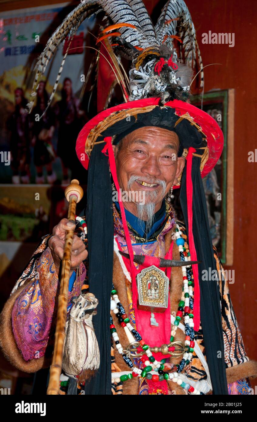 China: A Naxi dongba (shaman), Lijiang Old Town, Yunnan Province. The ...