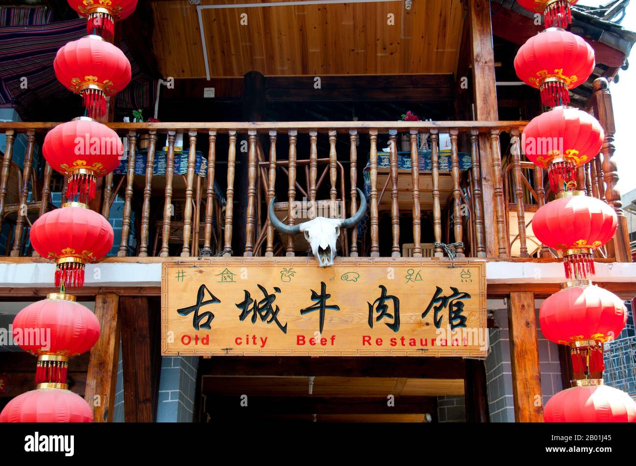 China: Restaurant sign displaying both Naxi (Dongba) and Chinese script ...