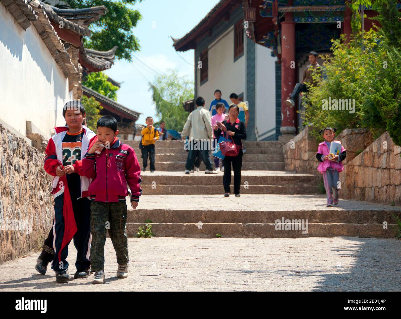 China: School children on a Lijiang Old Town back street, Yunnan ...