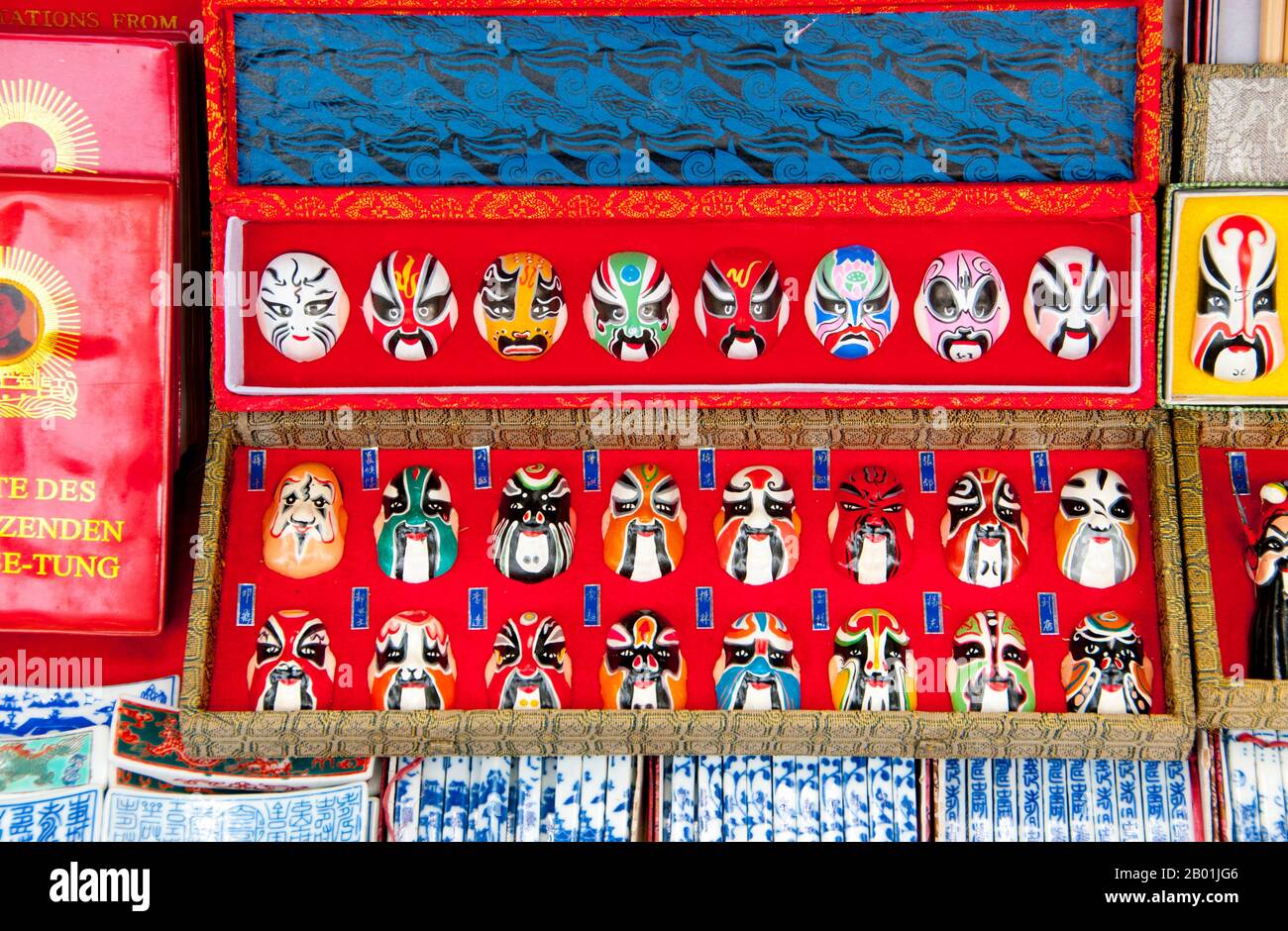 China: Dramatic miniature opera masks in the market next to the Li ...