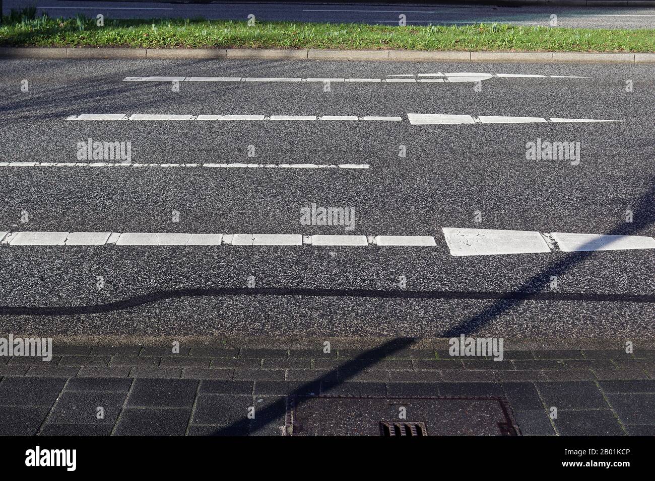 White lines and symbols on the asphalt of european roads Stock Photo ...