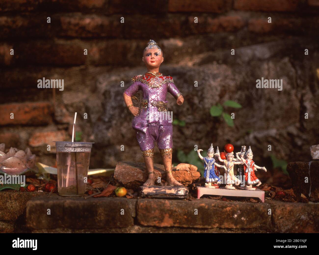 Thailand: Thai traditional dancer dolls placed on a small chedi behind ...