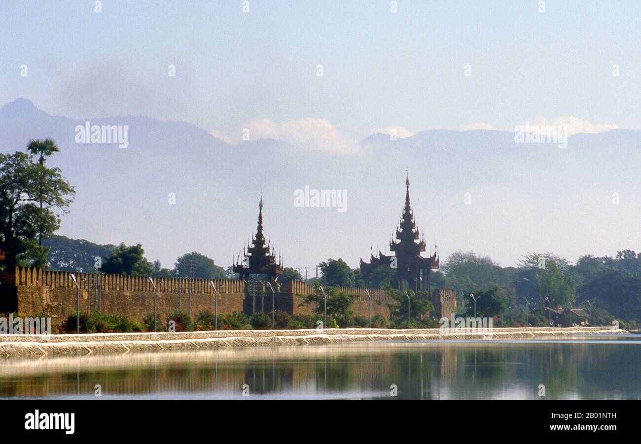 Burma/Myanmar: Early morning smoke and haze over Mandalay Fort with the Shan Plateau visible in ...