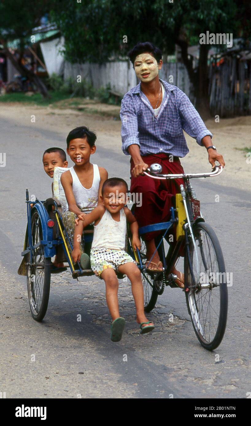 Burma/Myanmar: Three Bamar children riding a bicycle rickshaw, the ...