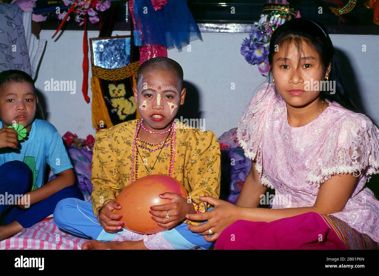 Thailand: A 'Crystal Son' sits with his mother on the eve of the Poy ...
