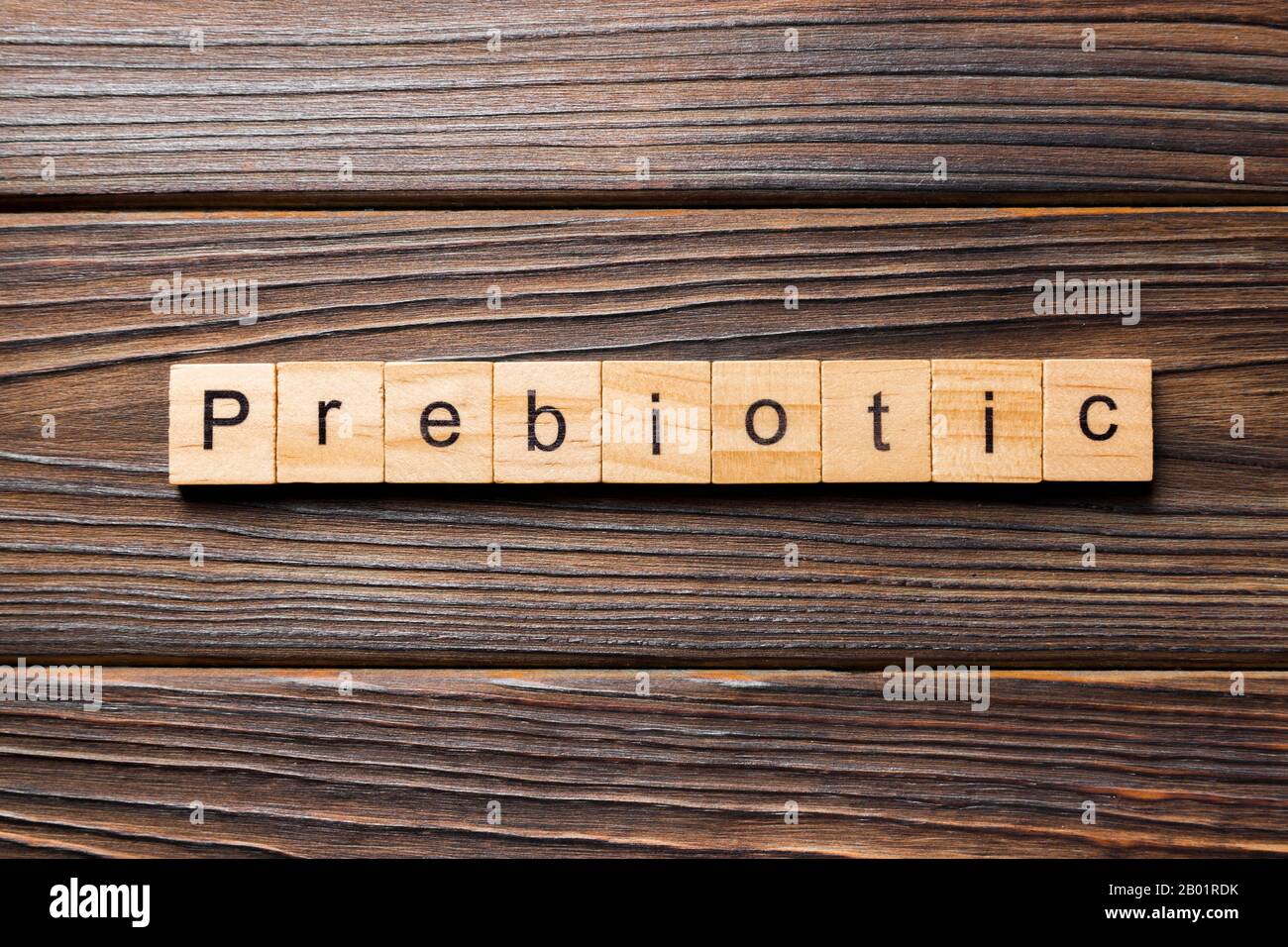 prebiotic word written on wood block. prebiotic text on table, concept ...