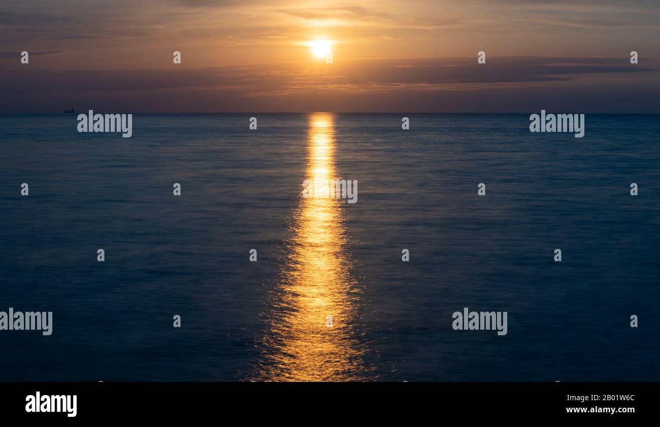 Sunset in the Black Sea with a ship at the horizon Stock Photo - Alamy
