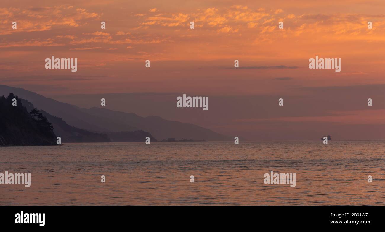Sunset in the Black Sea with a ship at the horizon Stock Photo - Alamy