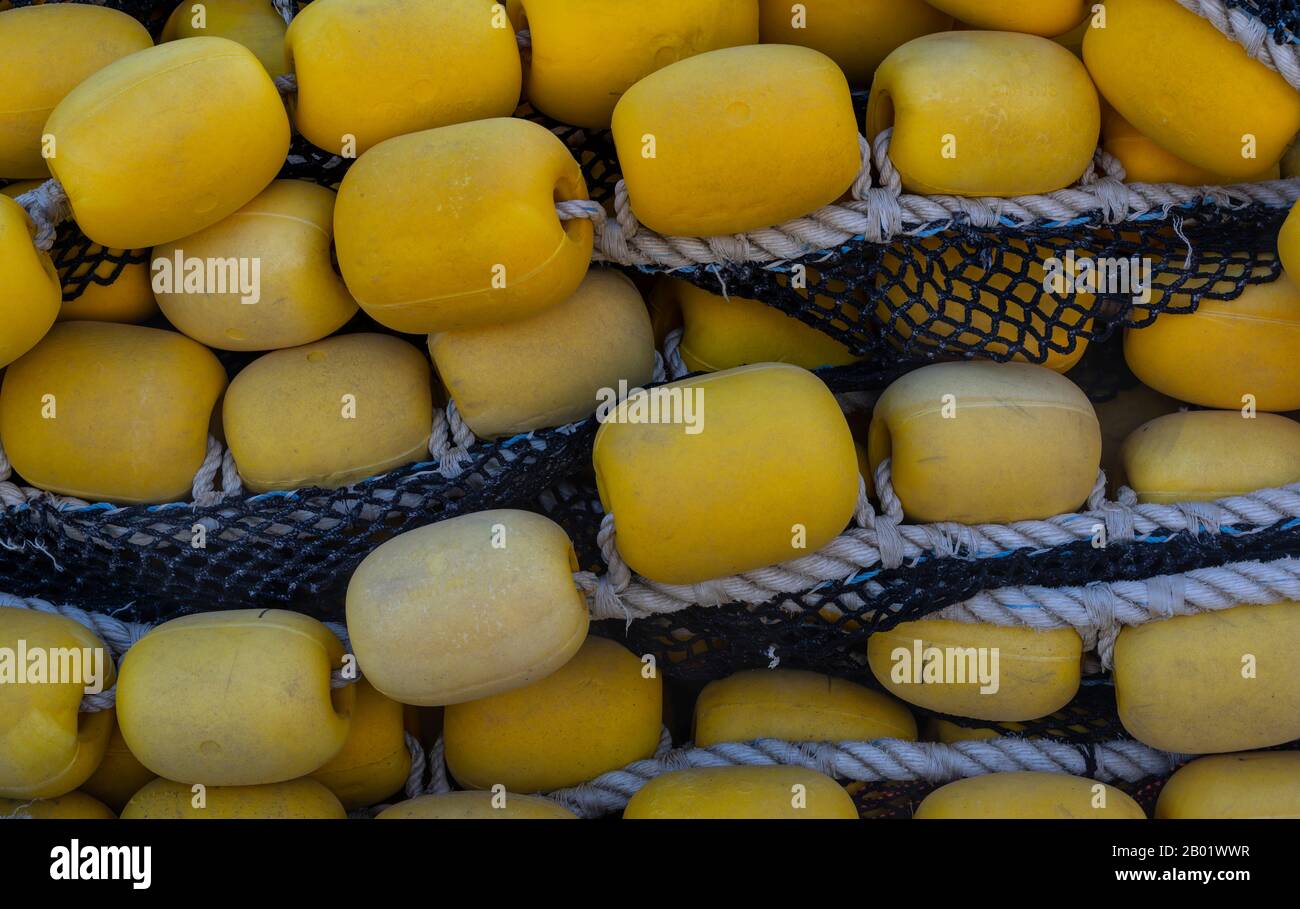 Colorful fishing net with yellow buoys in the Turkish town of Yalikoy ...