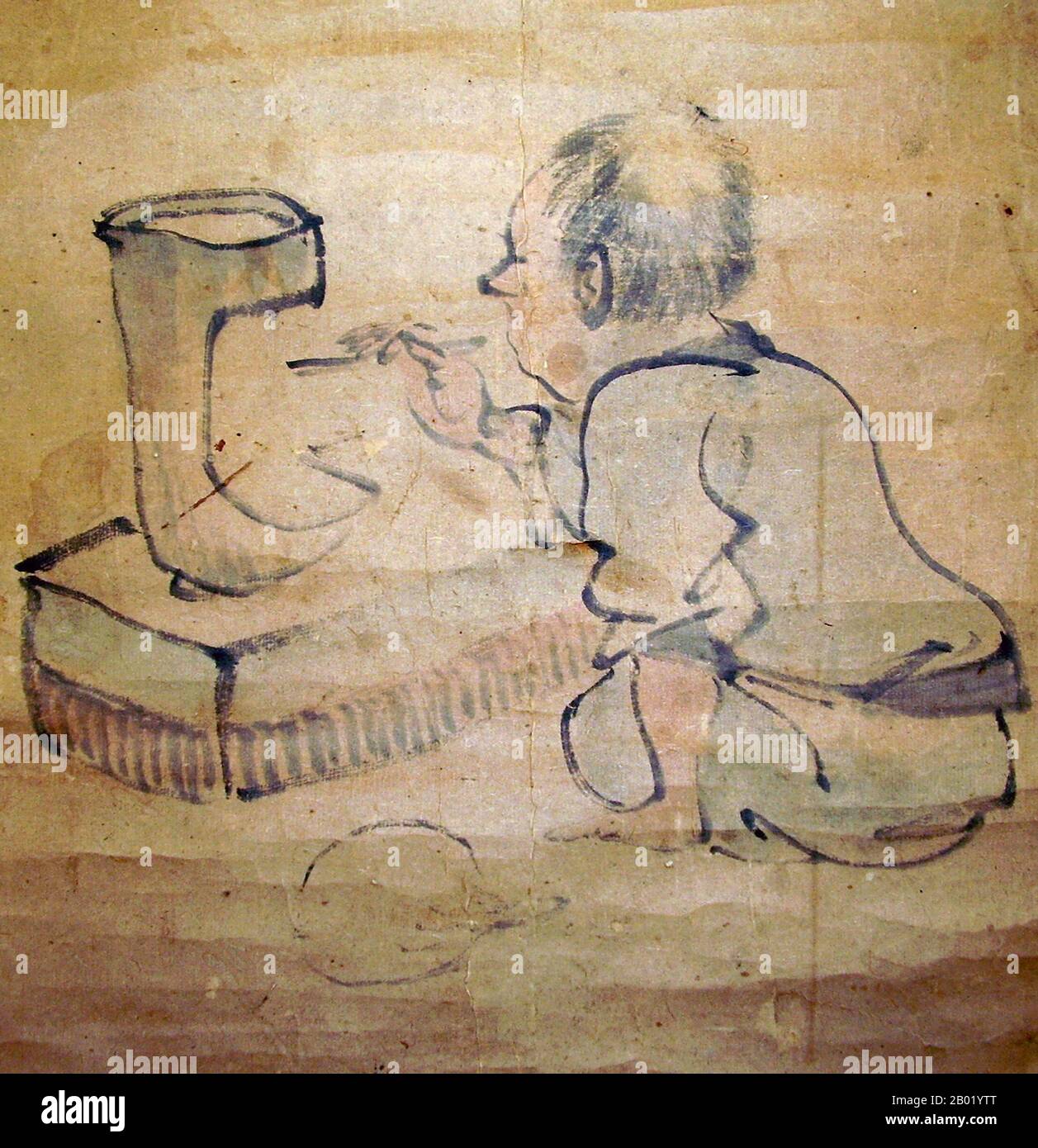 Japan: Man lighting a charcoal brazier in preparation for making tea ...