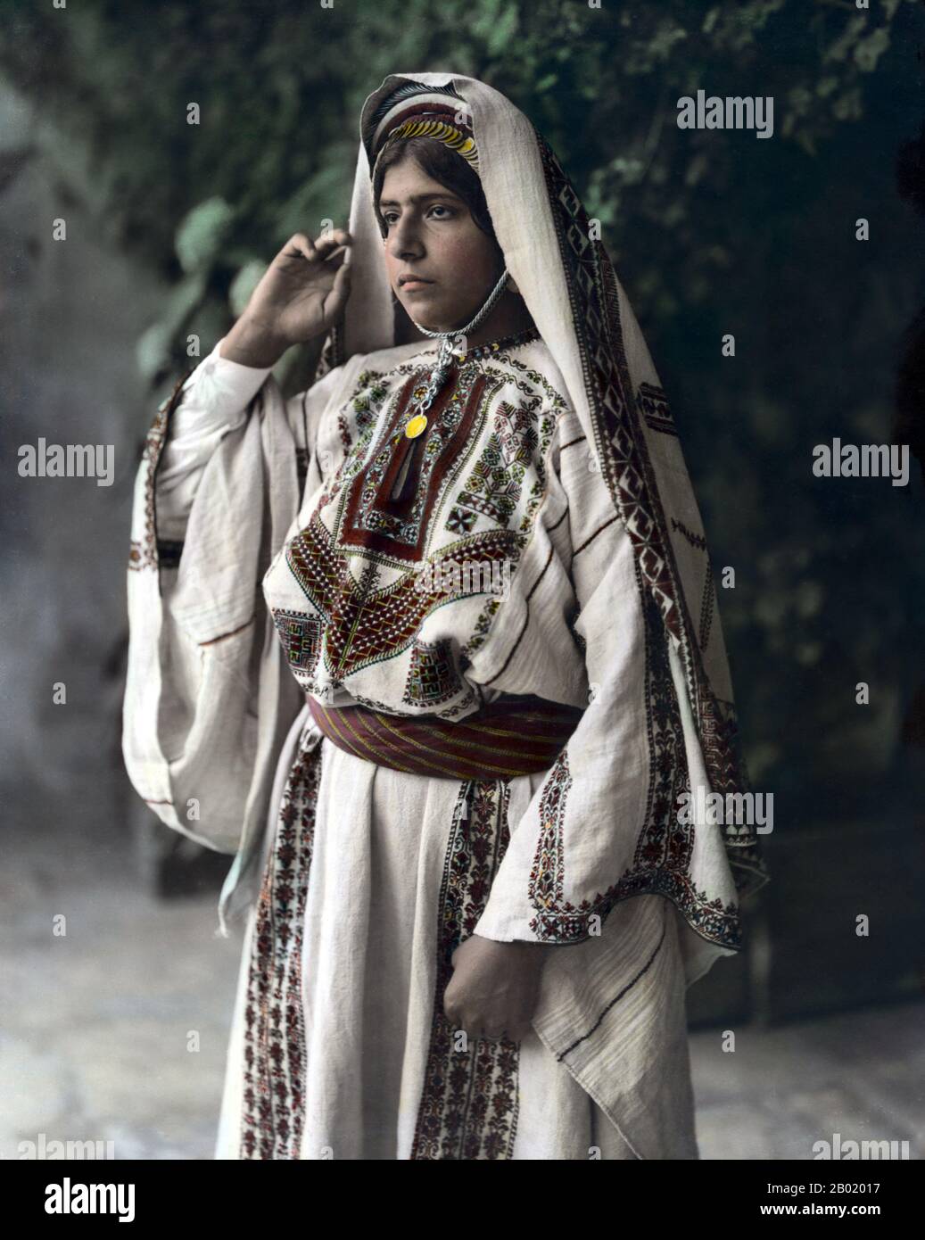 Palestine: Fahra Izhak Eadeh wearing an embroidered dress on her ...