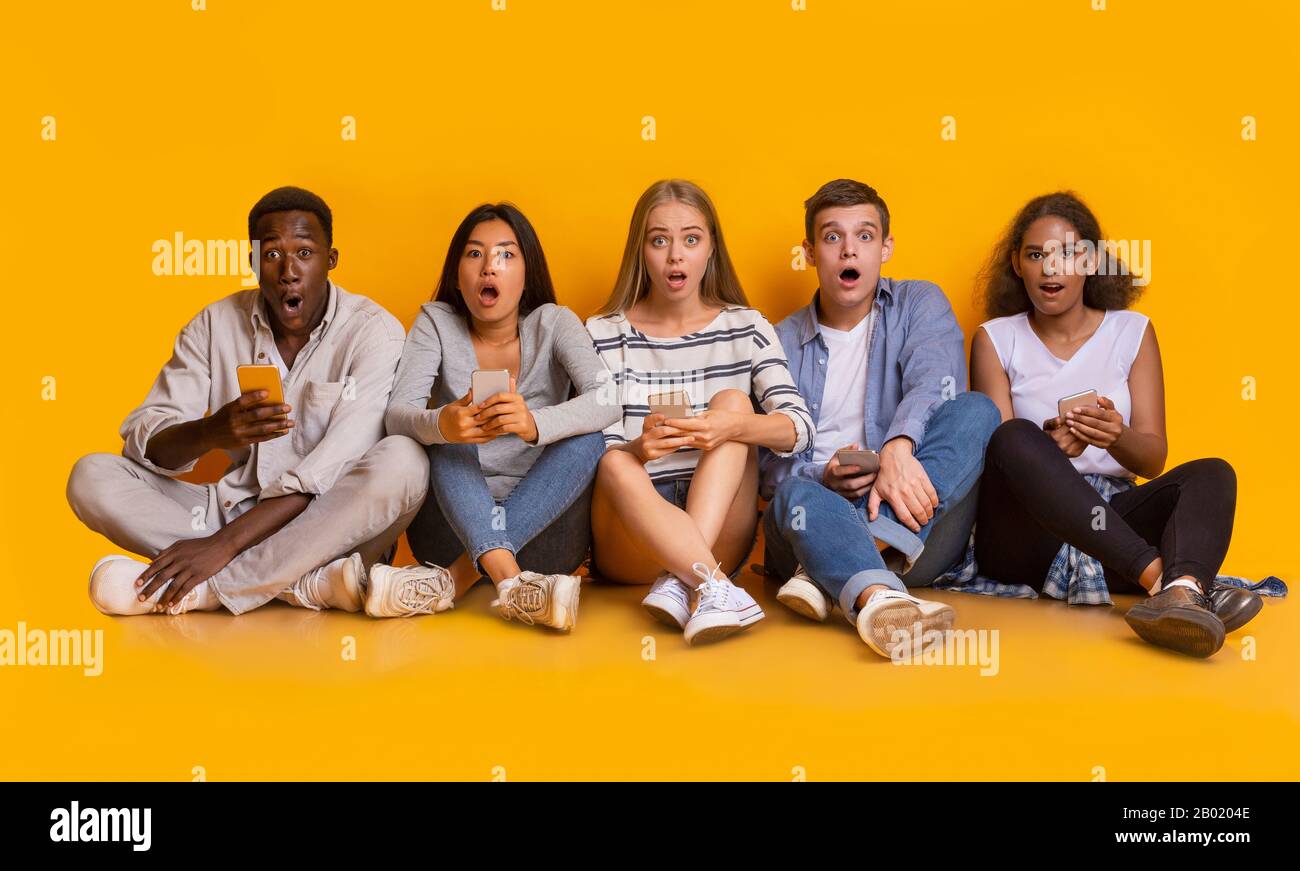 Group amazed shocked young friends hi-res stock photography and images ...