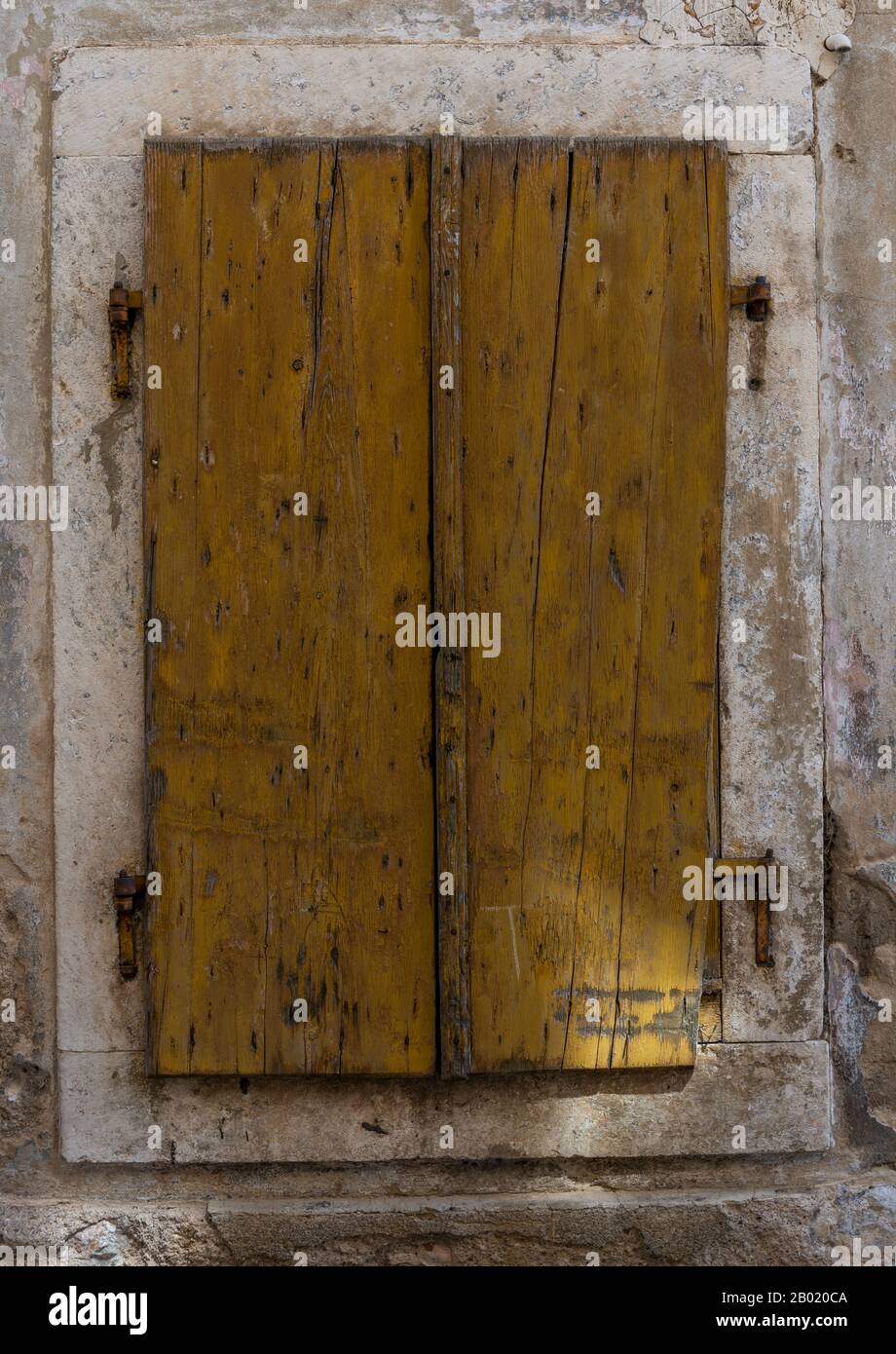 Yellow window with shutters in Senj, Croatia Stock Photo - Alamy