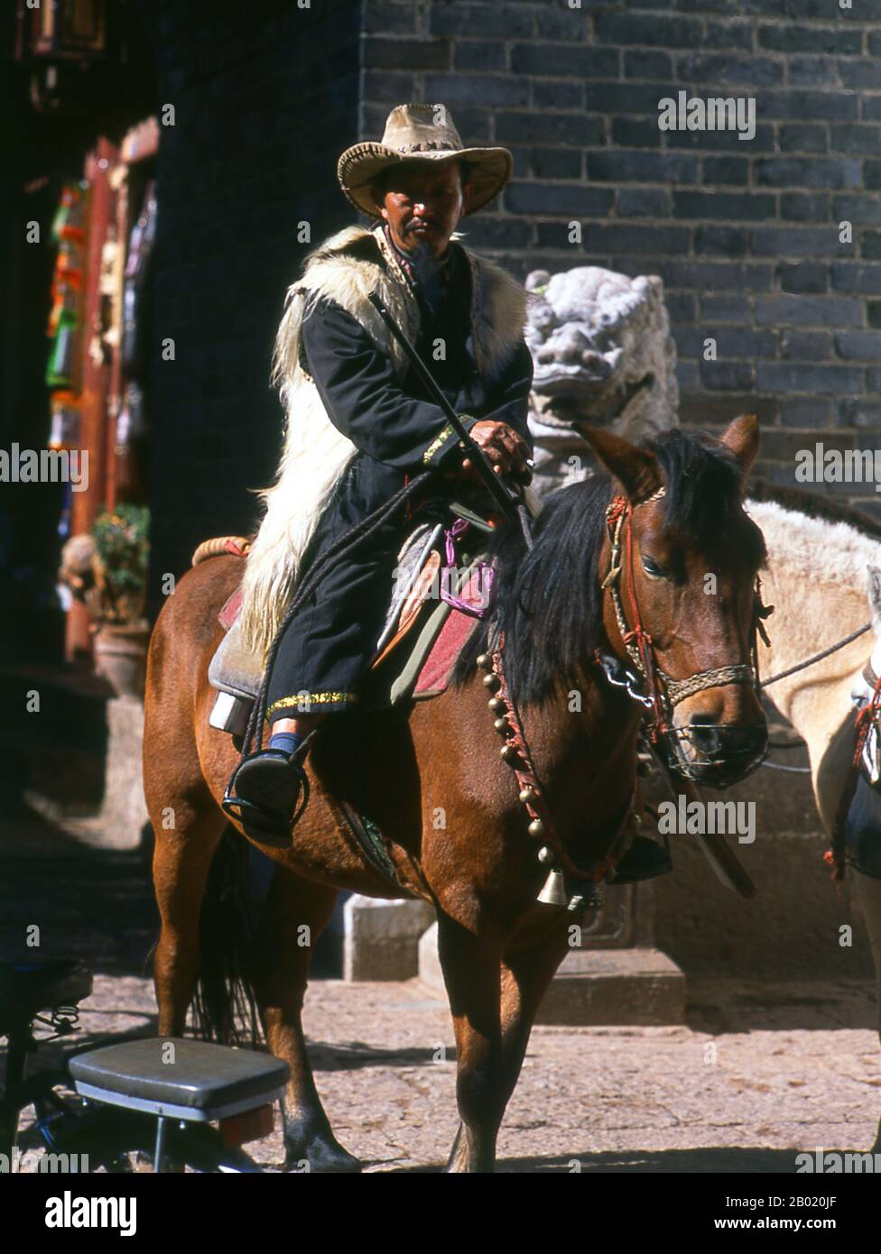 China: Naxi horseman, Lijiang Old Town, Yunnan Province. The Naxi or ...