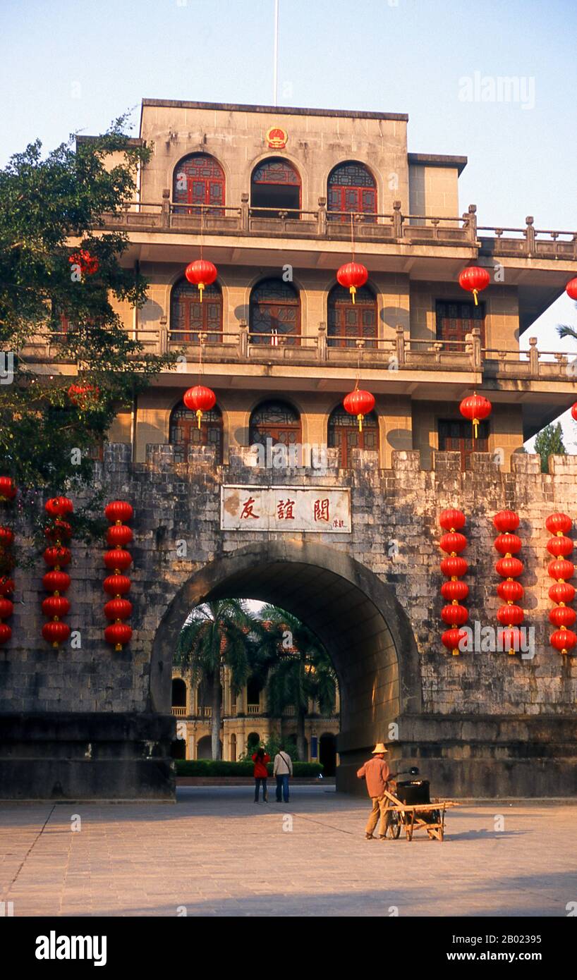 China: Ceremonial Chinese gateway with the old French Customs House in ...