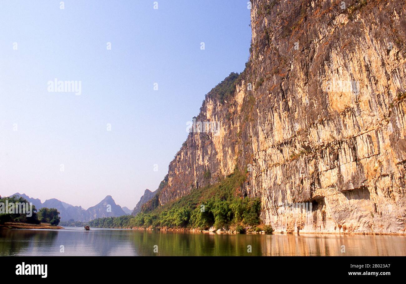 China: A boat travels past the towering karst peaks that line the Zuo ...