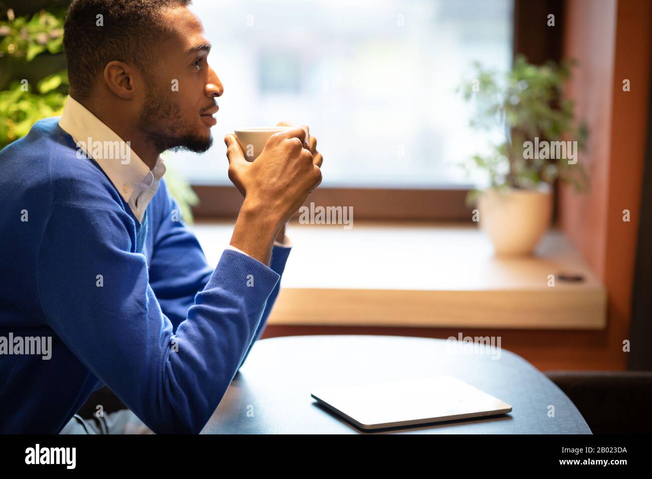Black guy drinking tea hi-res stock photography and images - Alamy