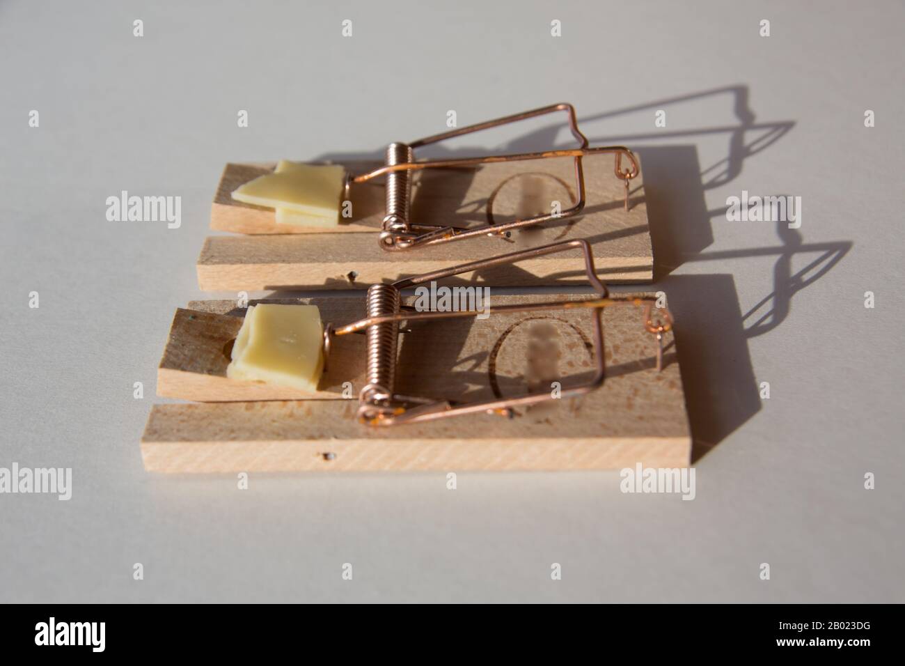 wooden mouse trap with bait as a trap Stock Photo - Alamy