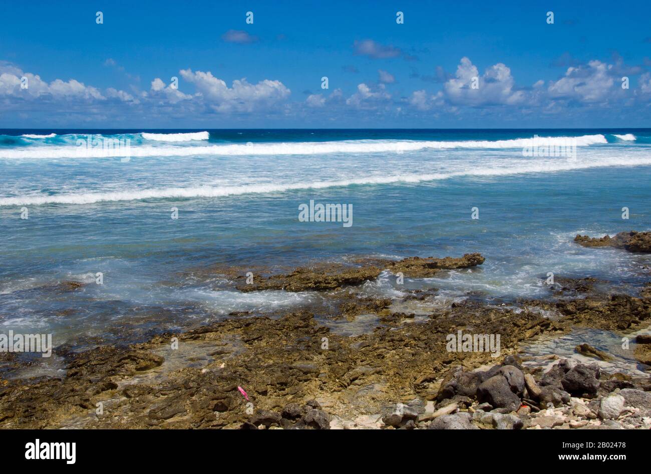 Maldives: Waves break on the coral reef which is very close to the ...