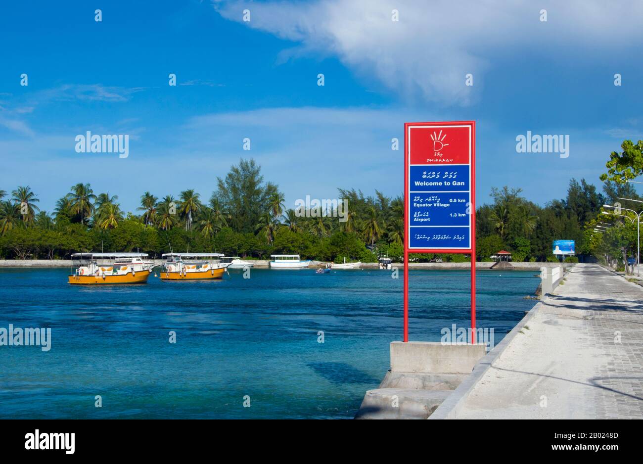 Maldives: Dive boats and 'Welcome to Gan' sign, Gan Island, Addu Atoll ...