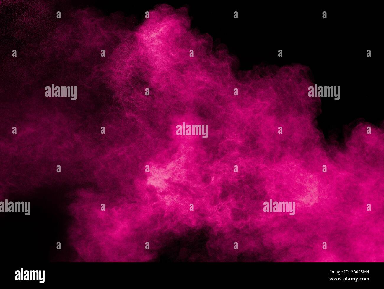 Abstract pink dust particles explosion on black background.Freeze ...
