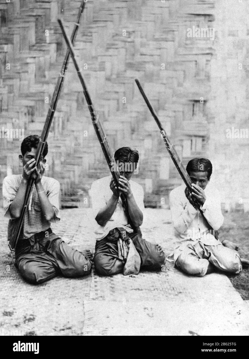 Laos: Men playing the khene, a bamboo flute, Luang Prabang, 1919. The ...
