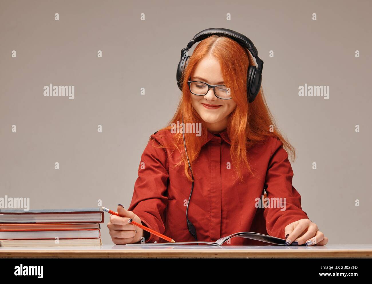 Cute girl headphones and book hi-res stock photography and images - Alamy