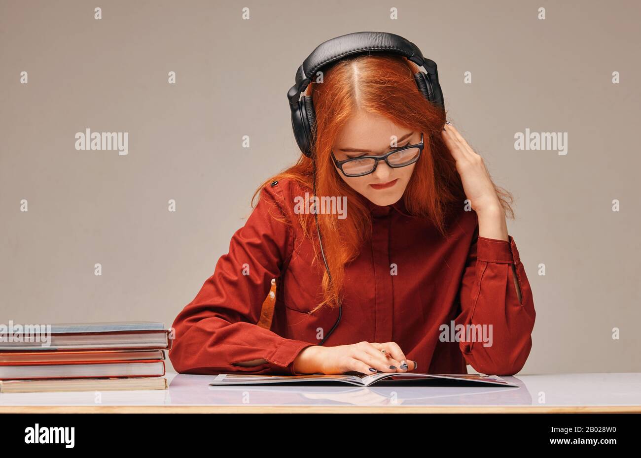 Cute girl headphones and book hi-res stock photography and images - Alamy