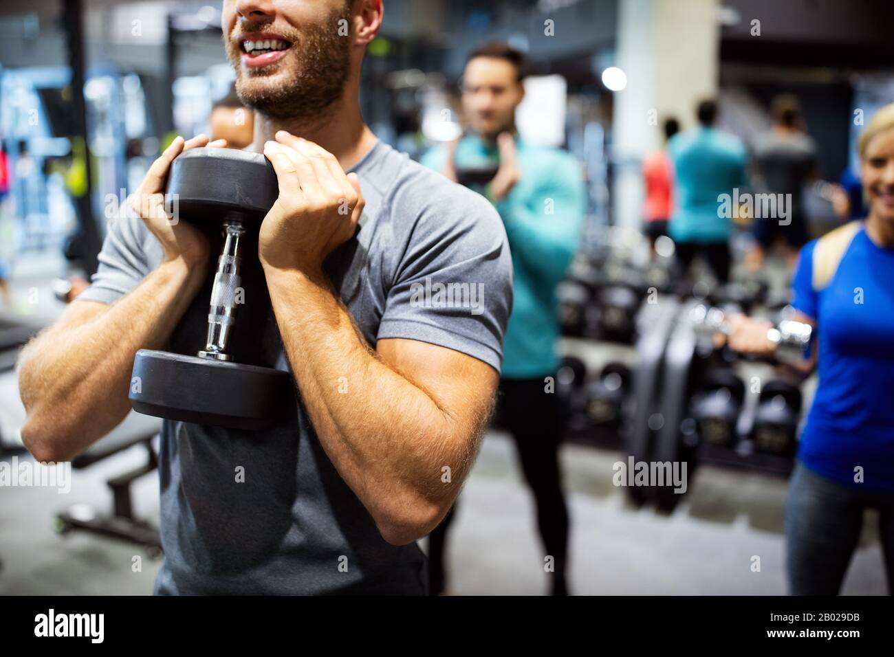Group of fit people in gym training. Multiracial group of friends ...