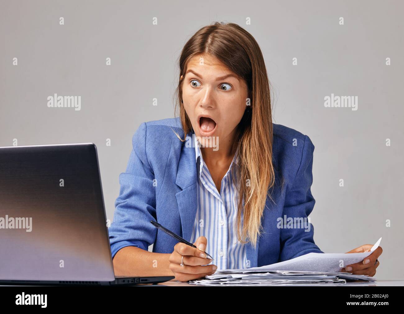 serious businesswoman working at the modern office desk with laptop ...