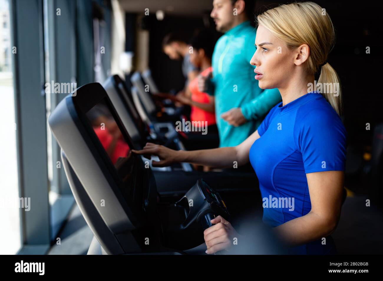 Machine training action woman hi-res stock photography and images - Alamy