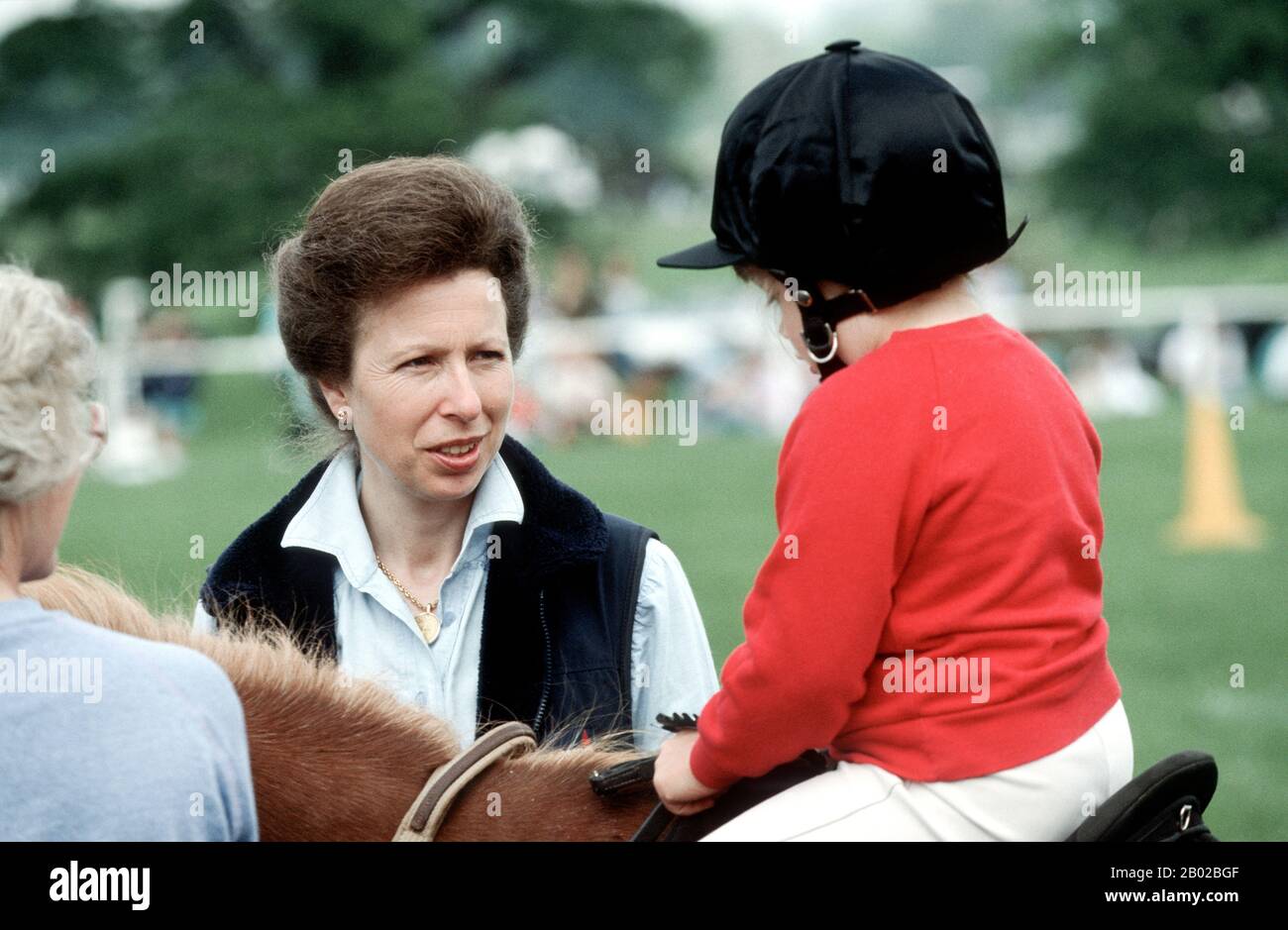 HRH Princess Anne with a child from Riding for the Disabled at the ...