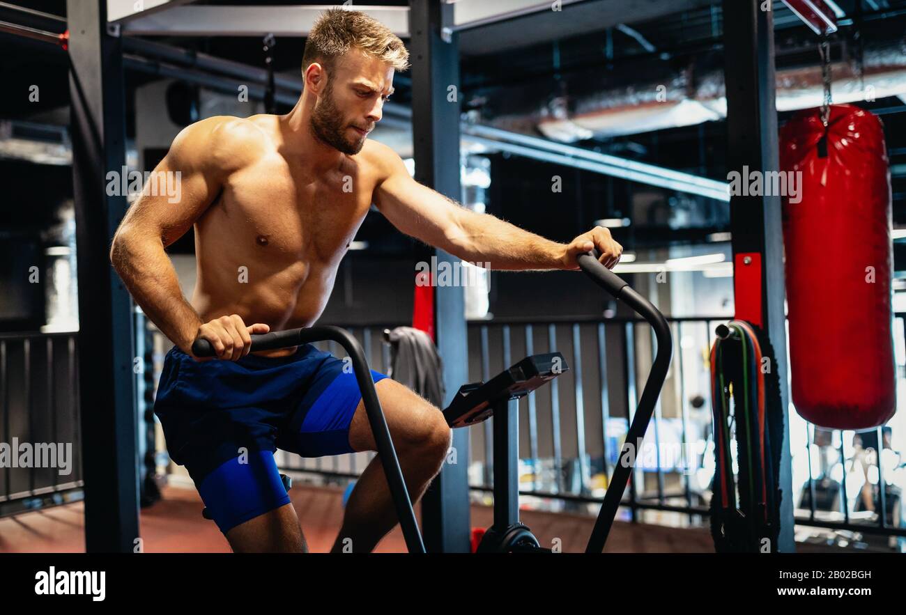 Strong guy doing hard exercises hi-res stock photography and images - Alamy