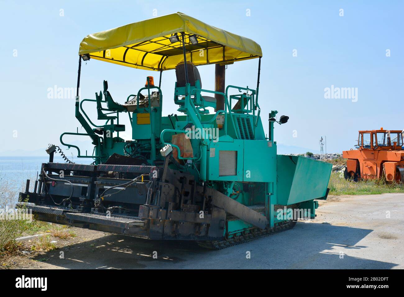 Greece, machine for road construction and road roller Stock Photo - Alamy