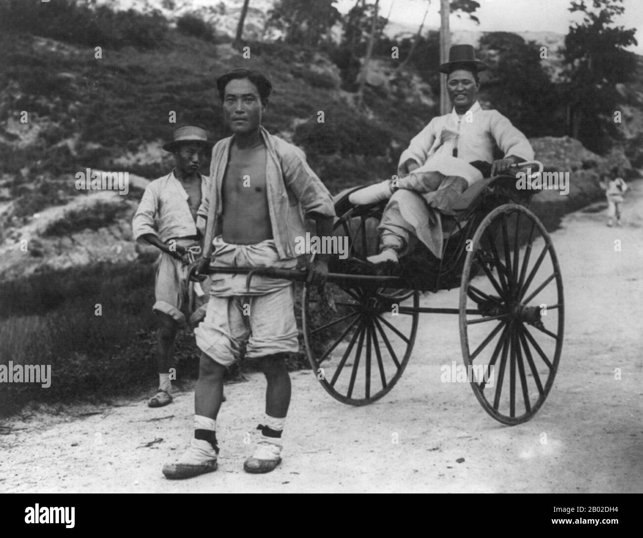 Korea: Mandarin being pulled in a rickshaw, c. 1910-1920. The rickshaw ...