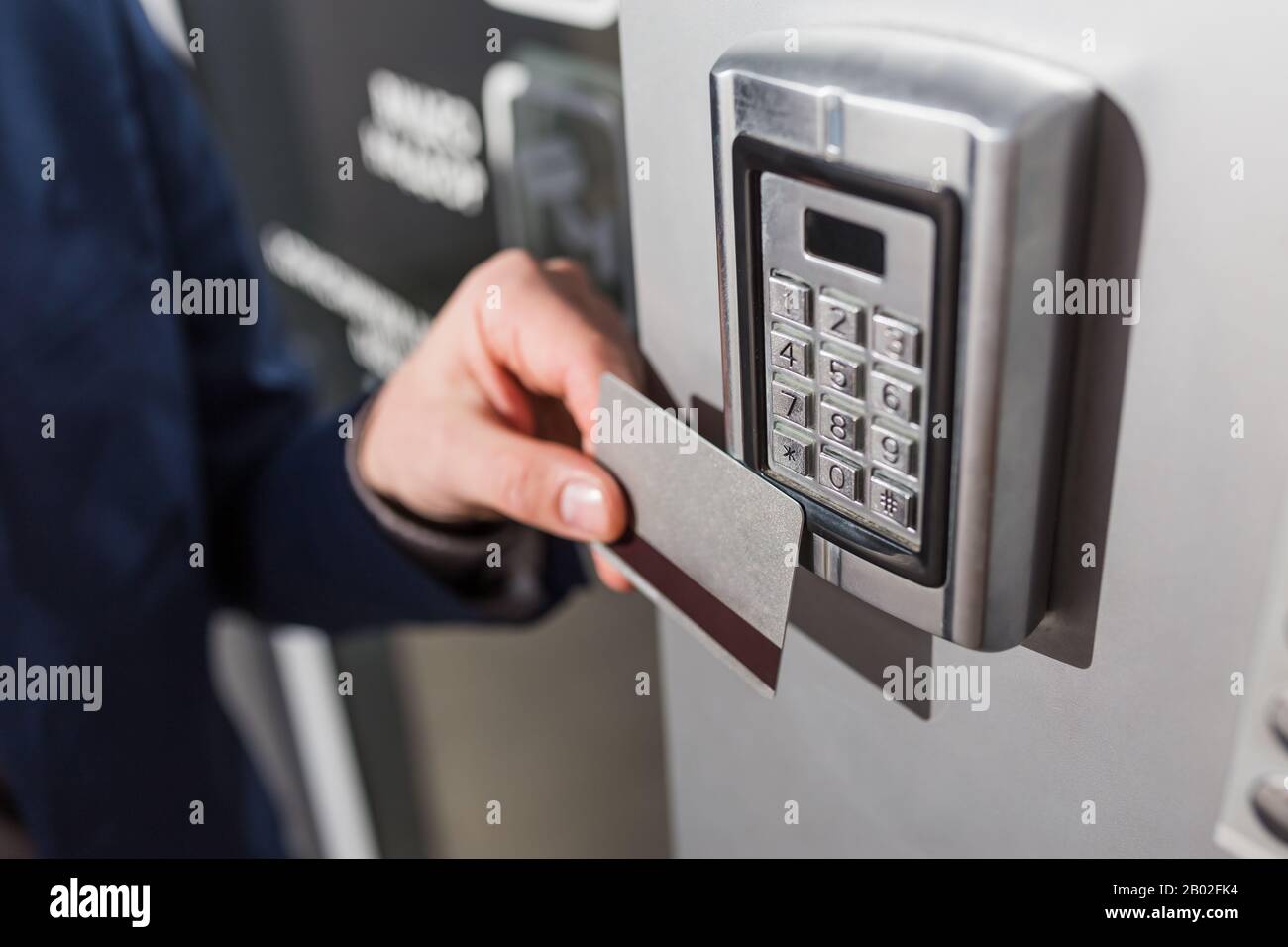 Man scanning security key card on electric lock to entry private ...