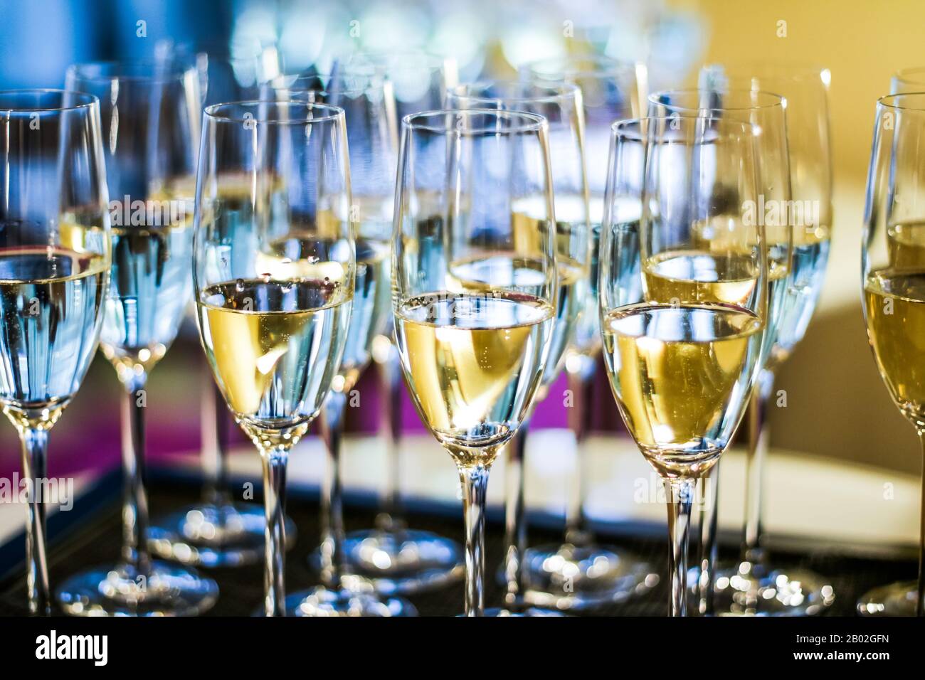 Drinks, celebration and luxury concept - Glasses of champagne and sparkling wine served on a ...