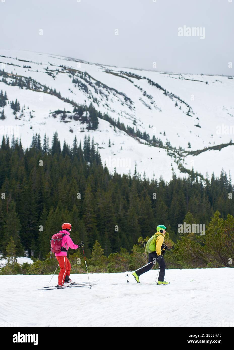 Skiers walking on side mountain hi-res stock photography and images - Alamy