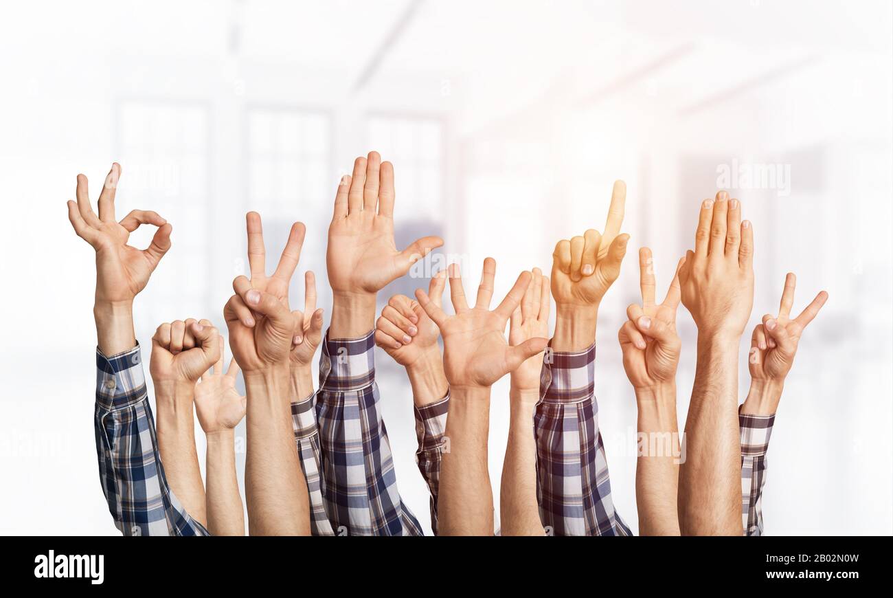 Row raised hands showing different hi-res stock photography and images ...