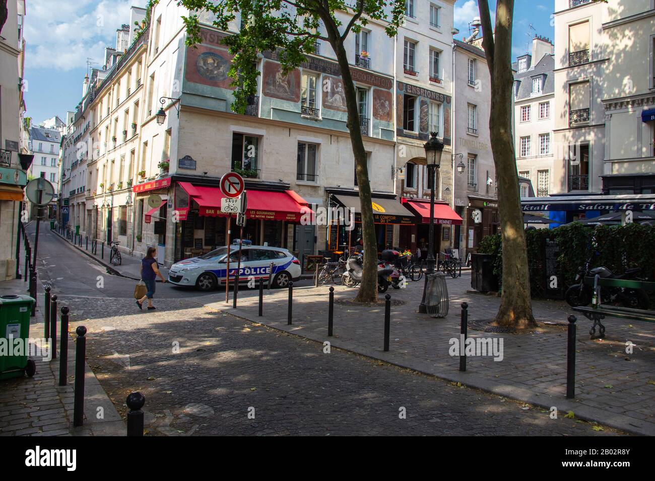 A police car and pedestrian at a street corner ,Paris Stock Photo - Alamy