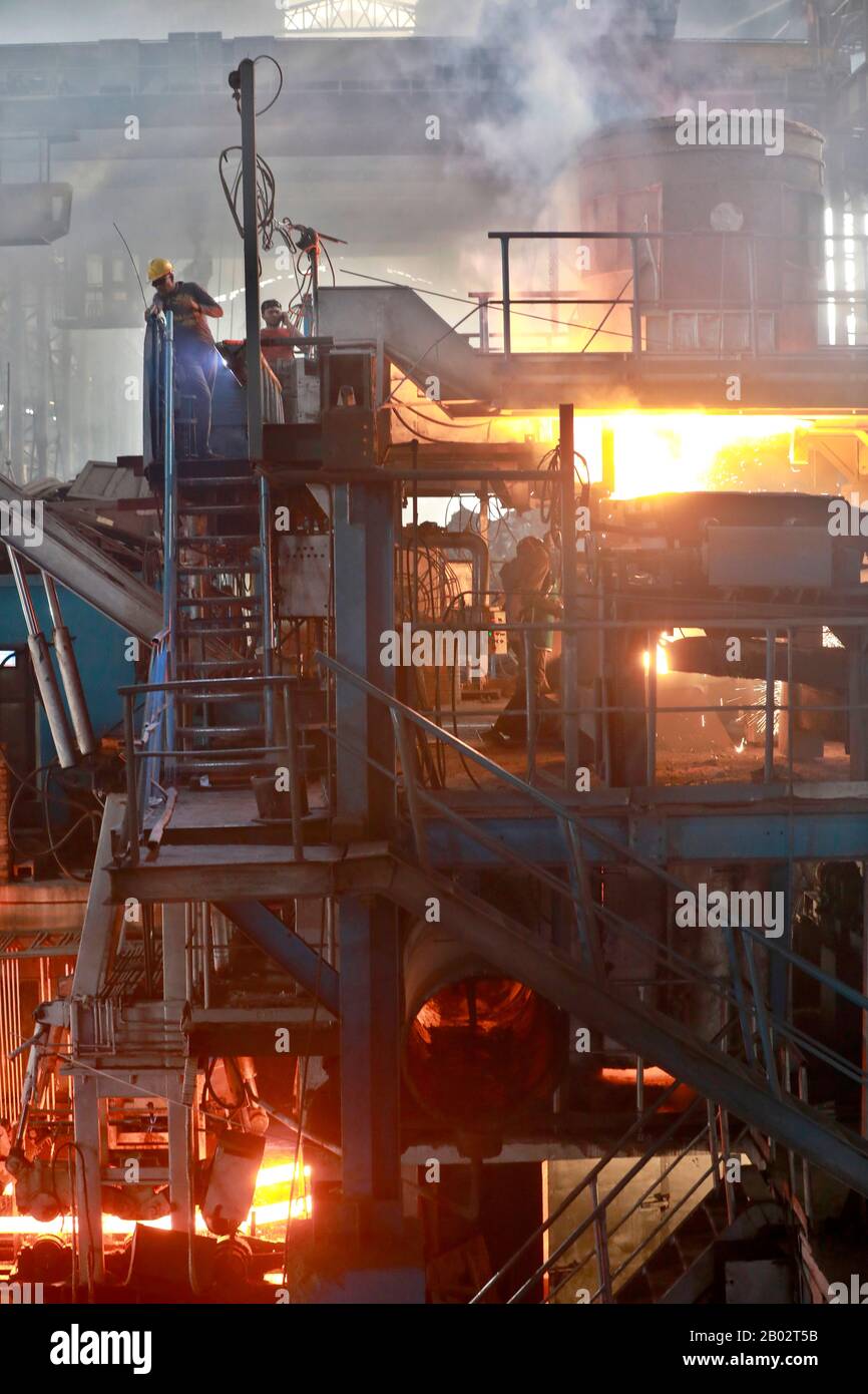 Dhaka, Bangladesh - February 12, 2020: Bangladeshi workers are working ...