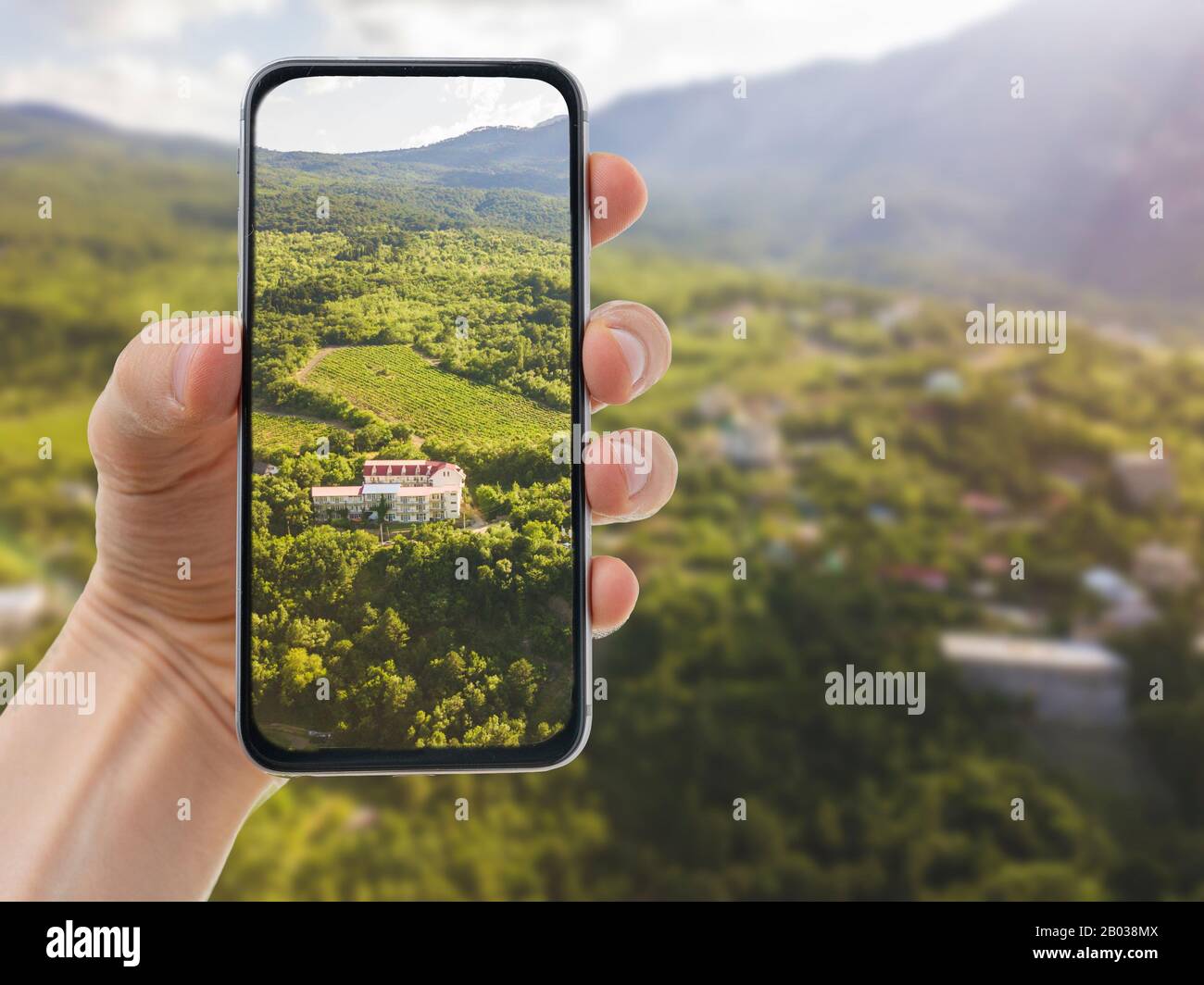 hand holding a mobile smartphone and taking landscape photography Stock ...