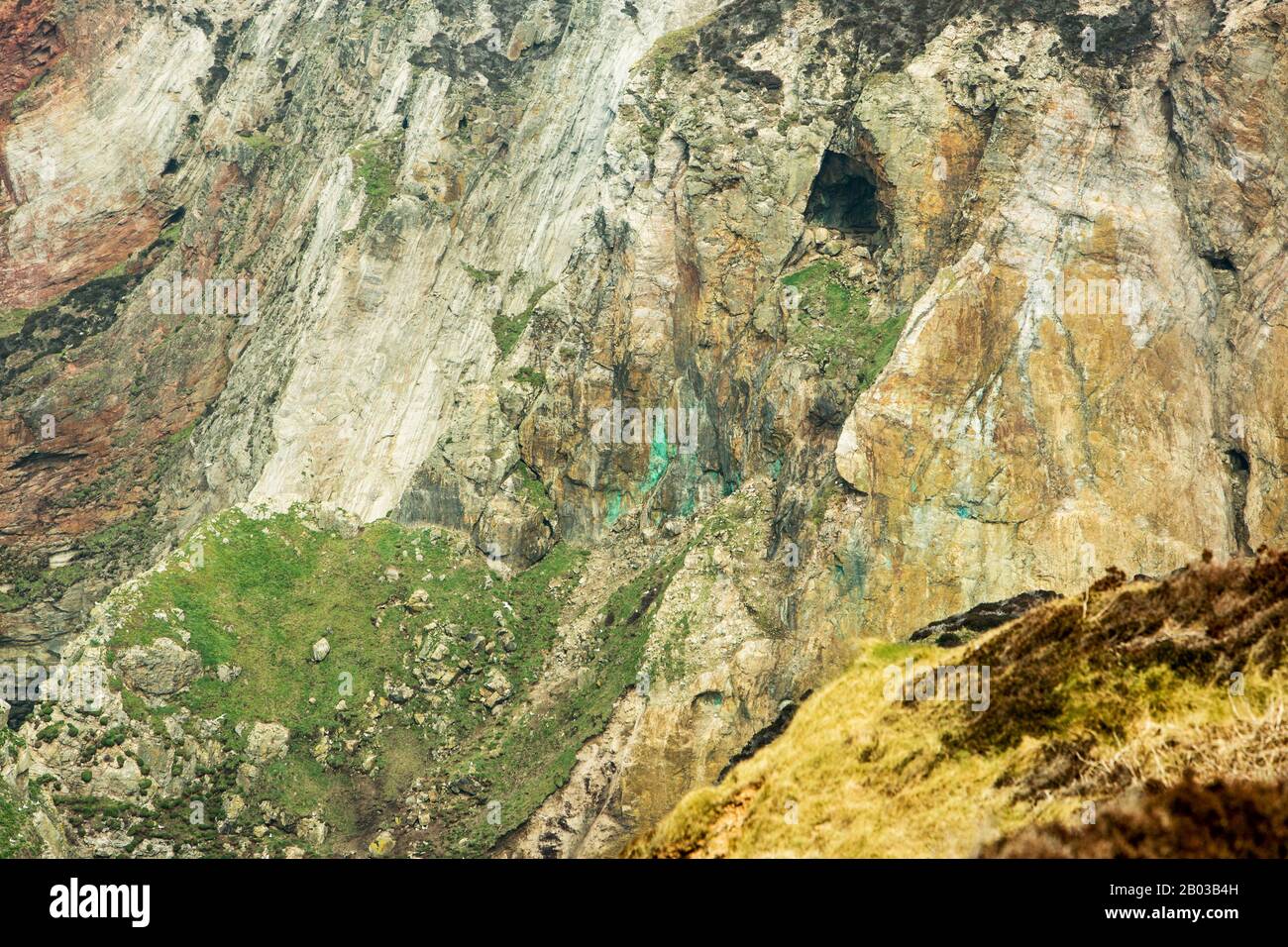 Close up vies of cliffs stained by minerals and copper at Cligga Head ...