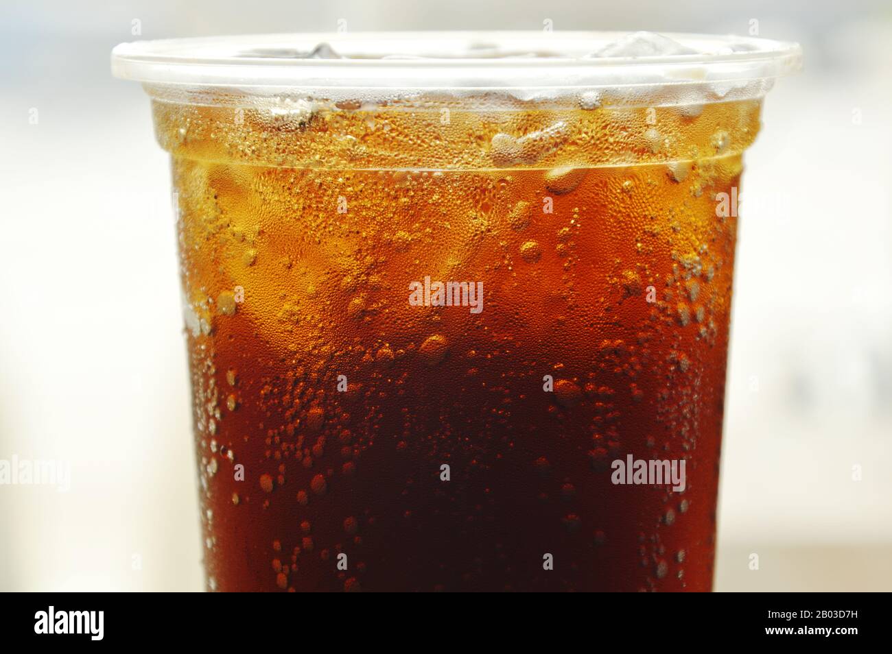 cola with ice in plastic cup Stock Photo - Alamy