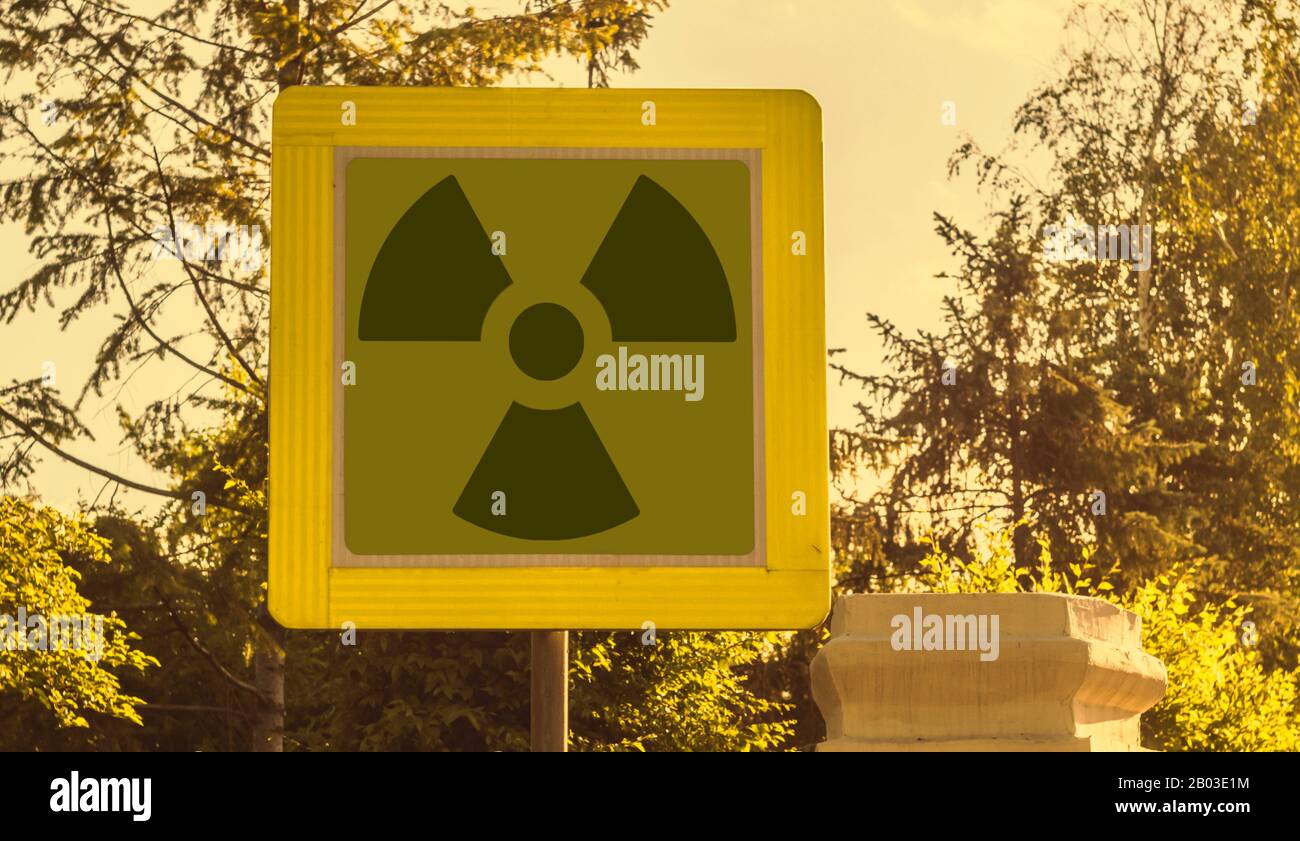 a Radioactivity and chemical hazard street sign with toxic clouds on ...