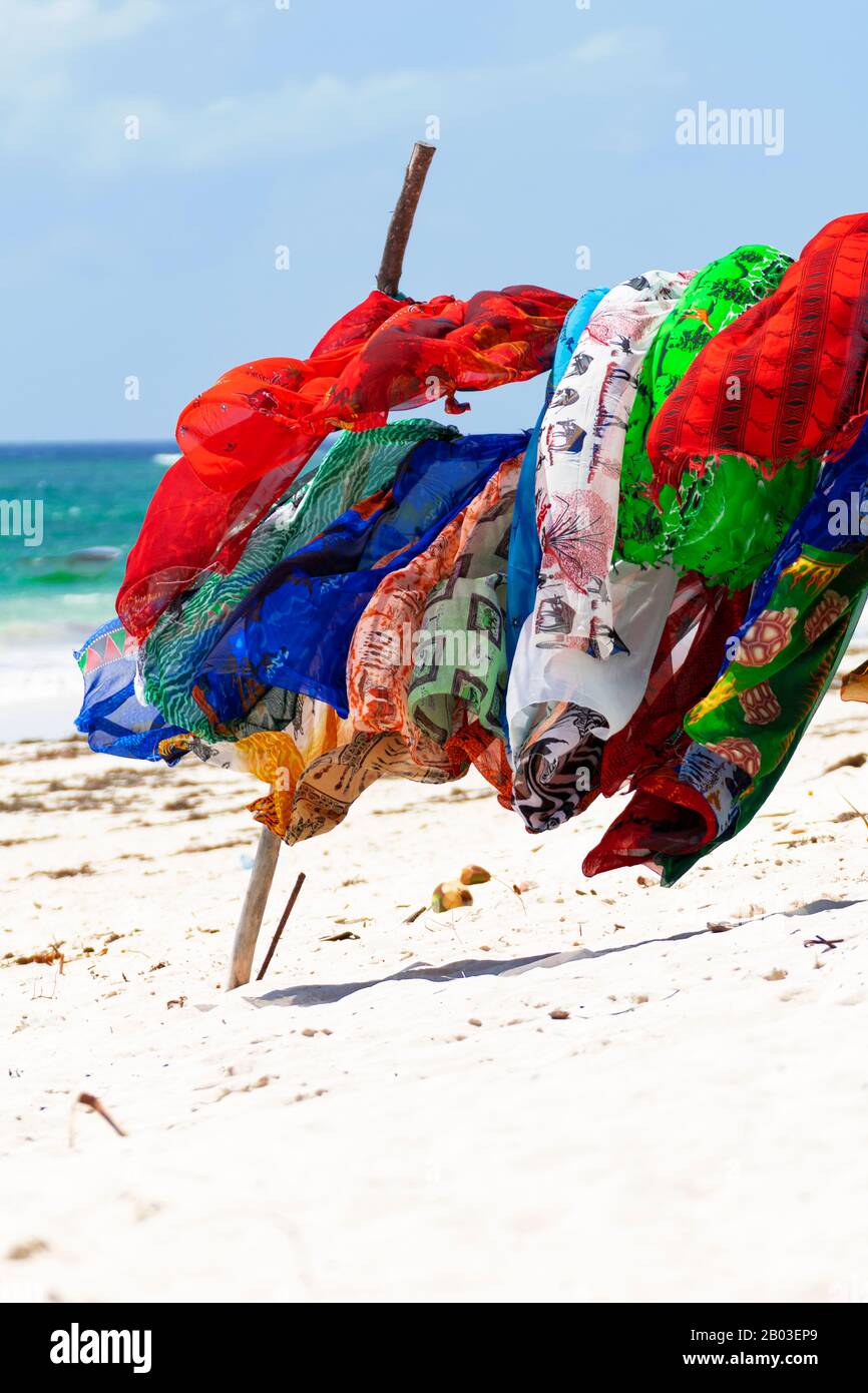 Multicolored textiles on the beach Stock Photo - Alamy