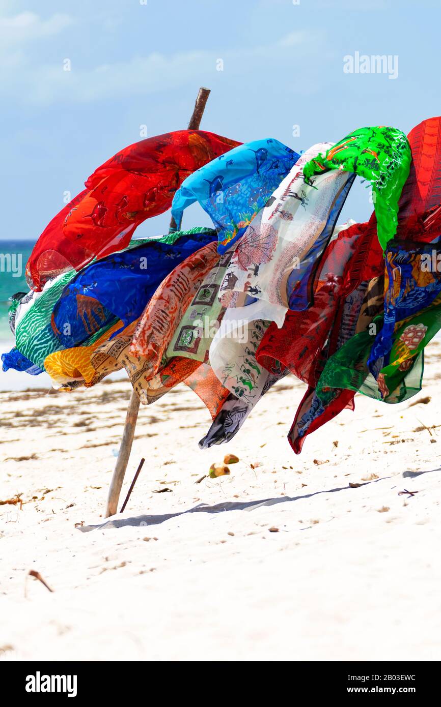 Multicolored textiles on the beach Stock Photo - Alamy