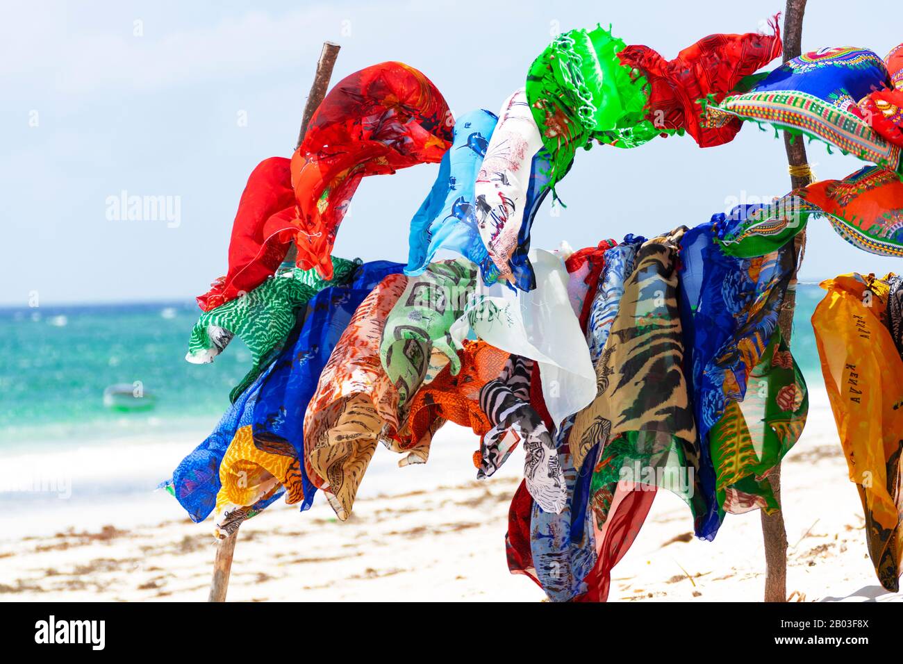 Multicolored textiles on the beach Stock Photo - Alamy