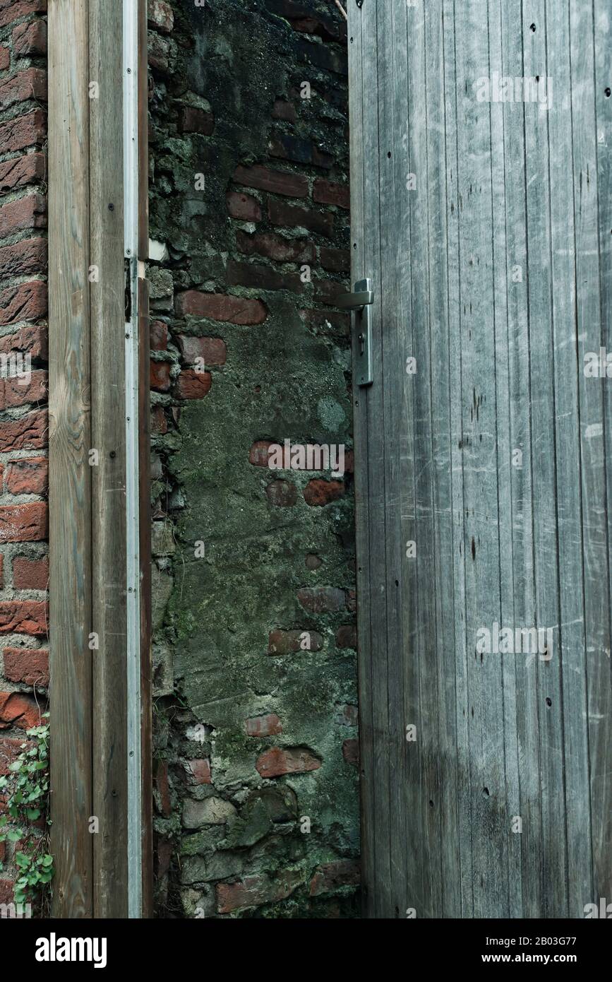 Weathered wooden garden door ajar Stock Photo - Alamy