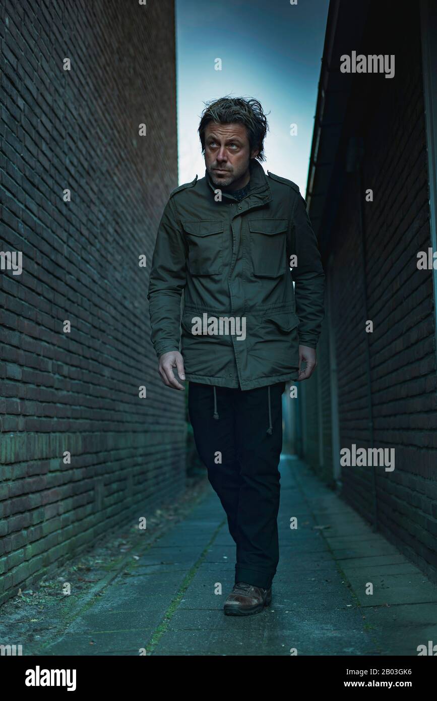 Suspicious man in street hi-res stock photography and images - Alamy